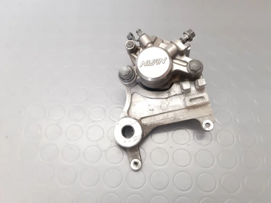 Rear brake caliper with mounting Honda NX 650 Dominator (RD02) Yr. 1988-94